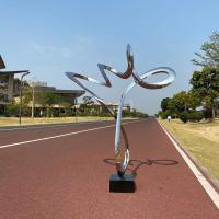 China Decorative Stainless Steel Polished Ribbon Sculpture 150cm Height Black Stone Base for sale