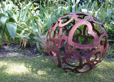 China Large Heart Pattern Corten Steel Hollow Sphere Metal Garden Ball 100 cm for sale