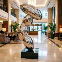 China Stainless Steel Abstract Sculpture 245cm Mirror Polished Metal Art for Villa Public Square for sale