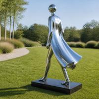 China Custom Mirror Polished Stainless Steel Contemporary Figure in a Flowing Coat for sale