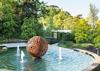 China Custom Corten Steel Rusty Hollow Ball Sculpture 1pc for Garden Decoration for sale