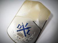 China Small Logo Adhesive Metal Label Plates Bag Accessories Brand Laser Out Sew Label for sale