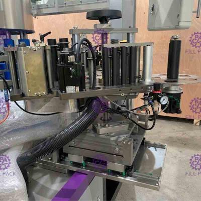 China Automatic Rotary Double Head Adhesive Labeling Machine 220V 200-230 Bottles Per Minute for sale