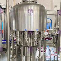 China Non Carbonated Drink Automatic Filling Machine 1200bph Rotary 3 In 1 for 2-5L PET Bottles for sale