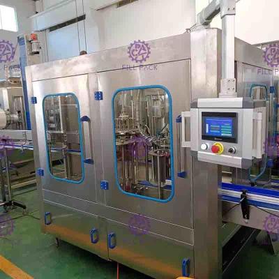 China Non Carbonated Drink Automatic Filling Machine 1200bph Rotary 3 In 1 for 2-5L PET Bottles for sale