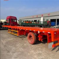 China Custom 3 Axles 4 Axles 40ft 48ft 53ft 60ft Shipping Container Flatbed Semi Trailer For Rwanda And Tanzania for sale