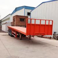 China New 3-Axle 12-Tire Flat Plate Semi-Trailer For Sale With Carrying Capacity Of 30-60 Tons Of 40-Foot Container for sale