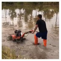 China Four-Wheel Drive 170F Gasoline Engine Mini Power Tiller Cultivator for Farm and Garden for sale