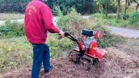 China 186F Diesel Engine Four-Wheel Drive Mini Power Tiller Cultivator for Farms Efficiency for sale