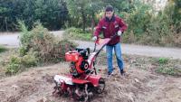 China 186F Diesel Engine Four-Wheel Drive Mini Power Tiller Cultivator for Farms Efficiency for sale