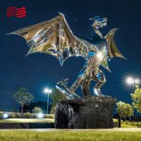 China Standing at 27 feet tall, the mirror-polished stainless steel dragon on a volcanic-rock-like steel and concrete perch ca for sale