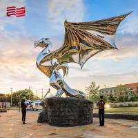 China Standing at 27 feet tall, the mirror-polished stainless steel dragon on a volcanic-rock-like steel and concrete perch ca for sale