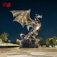 China Standing at 27 feet tall, the mirror-polished stainless steel dragon on a volcanic-rock-like steel and concrete perch ca for sale