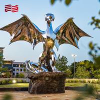 China Standing at 27 feet tall, the mirror-polished stainless steel dragon on a volcanic-rock-like steel and concrete perch ca for sale
