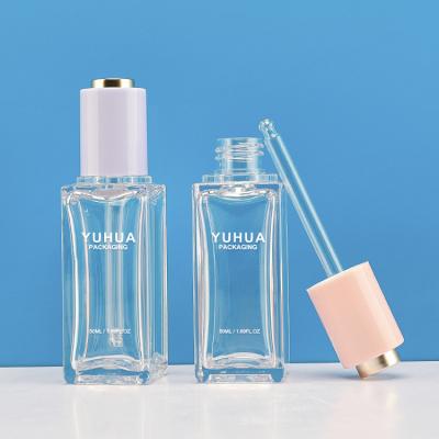 China 50ml Plastic Packaging Bottles Twist Push Button Press Clear Serum Dropper Bottle for sale