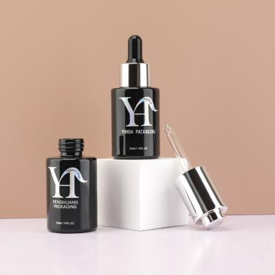 China Round Serum Dropper Bottles 30ml With Silver Dropper Oil Packaing for sale