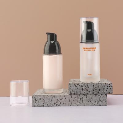 China Cylinder Glass Lotion Pump Bottles 30ml Clear Empty Liquid Foundation Containers for sale