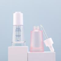 China 30ml Serum Oil Dropper Glass Bottle With Press Pump for sale