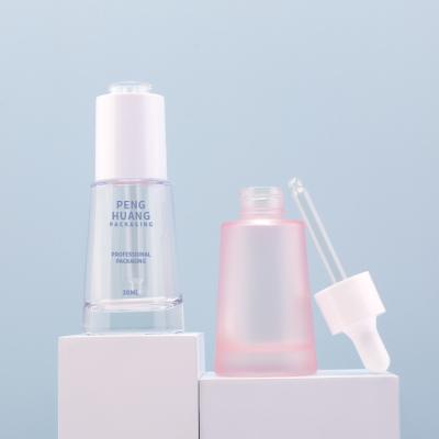 China 30ml Serum Oil Dropper Glass Bottle With Press Pump for sale