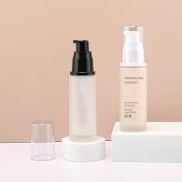 China 30ml Frosted Glass Liquid Foundation Bottles With Pump Round Shape for sale