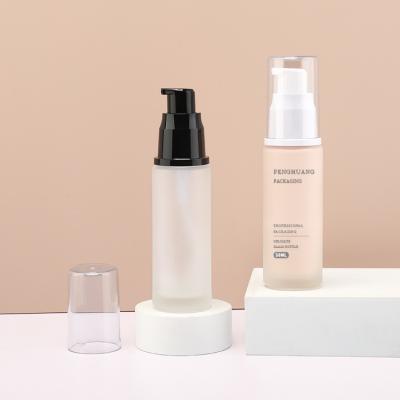 China 30ml Frosted Glass Liquid Foundation Bottles With Pump Round Shape for sale