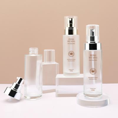 China 100ml Frosted Aluminum Glass Lotion Pump Bottle Skincare Cylinder Shape for sale
