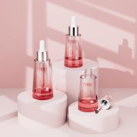 China Transparent Red Glass Dropper Bottle For Serum Lotion Toner for sale