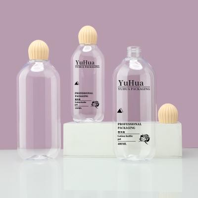 China Custom Logo Plastic Packaging Bottles Clear Round Plastic Shampoo Bottle 250ml 400ml for sale