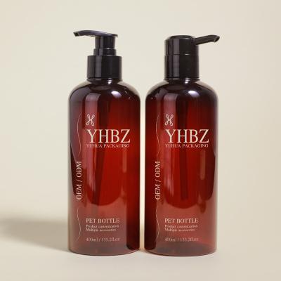 China 400ml PET Plastic Plastic Shampoo And Conditioner Bottles Round Amber Lotion Pump Bottle for sale