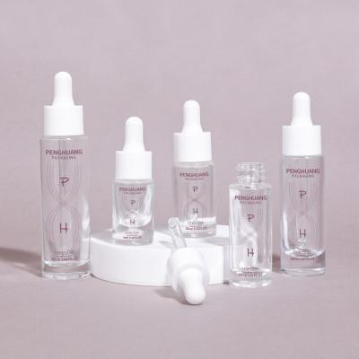 China Custom Logo Transparent Oil Dropper Glass Bottle For Serum Hair Oil for sale