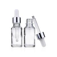 China 20ml Clear Glass Dropper Bottles Wholesale Essential Oil Cosmetic Containers with Customizable Caps for sale