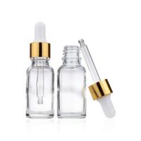 China 20ml Clear Glass Dropper Bottles Wholesale Essential Oil Cosmetic Containers with Customizable Caps for sale