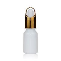 China Luxury 10ml White Glass Dropper Bottle For Essential Oil With Gold Pipettes for sale