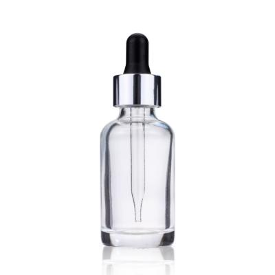 China Round Shape Empty Essential Oil Bottles 30ml Clear Glass Dropper Bottles for sale