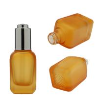 China Frosted 50ml Square Glass Serum Dropper Bottle with Pump Cap for Essential Oils for sale