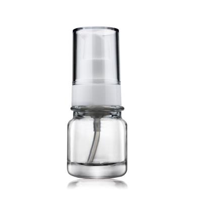 China Cosmetic Packaging 30ml Round Clear Serum Lotion Foundation Glass Bottle With Pump for sale