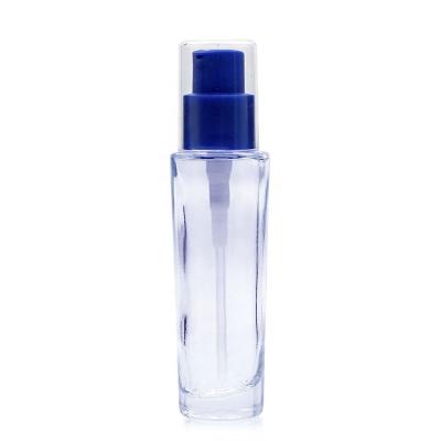 China Empty 33ml Liquid Foundation Bottles Cosmetic Glass Bottle Bule Pump Cap for sale
