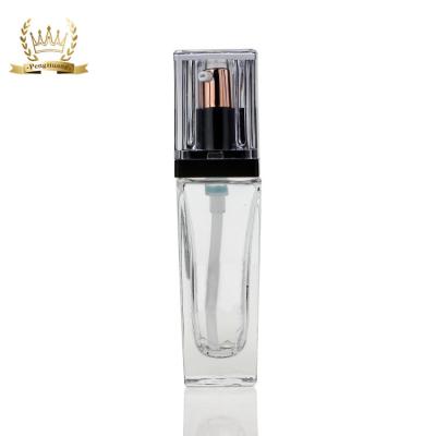 China Fancy Transparent 35ml Cosmetic Empty Square Glass Foundation Powder Bottle for sale