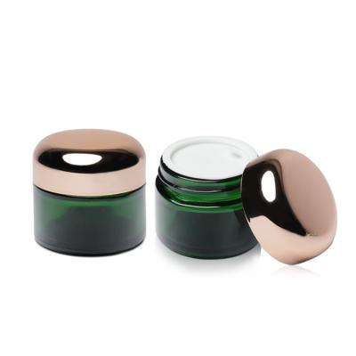 China 20g 30g Green Glass Cosmetic Jars Straight Round With Screw Cap for sale