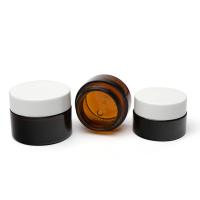 China 30g 1oz Round Amber Glass Cream Jars Cosmetic Containers With Screw Cap for sale