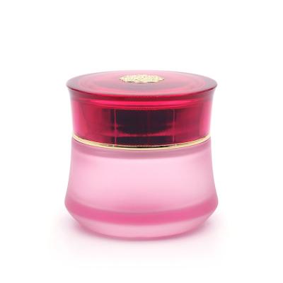 China Luxury Pink 50ml Cream Glass Jars Round Frost With Plastic Cap for sale