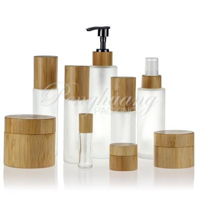 China 50g Face Cream Recycled Cosmetic Glass Jar With Bamboo Cap for sale