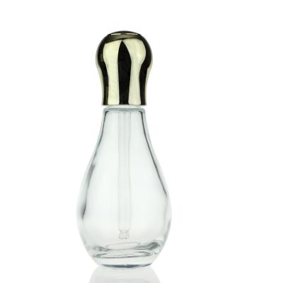 China 60ml Serum Dropper Bottles Unique Shape Glass Bottle For Serum With Gold Cap for sale