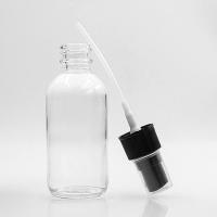 China Liquid 120ml Clear Boston Glass Bottles With Pump Spray for sale