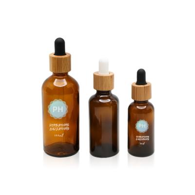 China Personal care bamboo Amber Oil Dropper Glass Bottle for sale