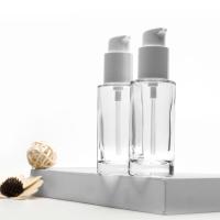 China 30ml Empty Lotion Bottle Transparent Foundation Glass Serum Lock Pump Bottle for sale