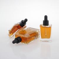 China Flat Square Serum Glass Dropper Bottles 30ml 50ml 100ml With Black Gold Collar for sale