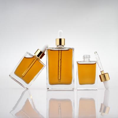 China Transparent Custom Logo Bottle 30ml 50ml 100ml With Gold Dropper for sale