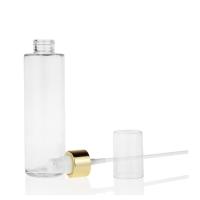 China Cosmetic Clear Glass Lotion Sprayer Pump Bottle With Cap Gold Line Pump for sale