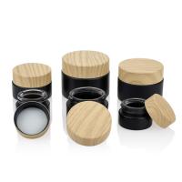 China Cosmetic Packaging Set Bamboo Color Screw Cap Black Matte Glass Jars 50g for sale